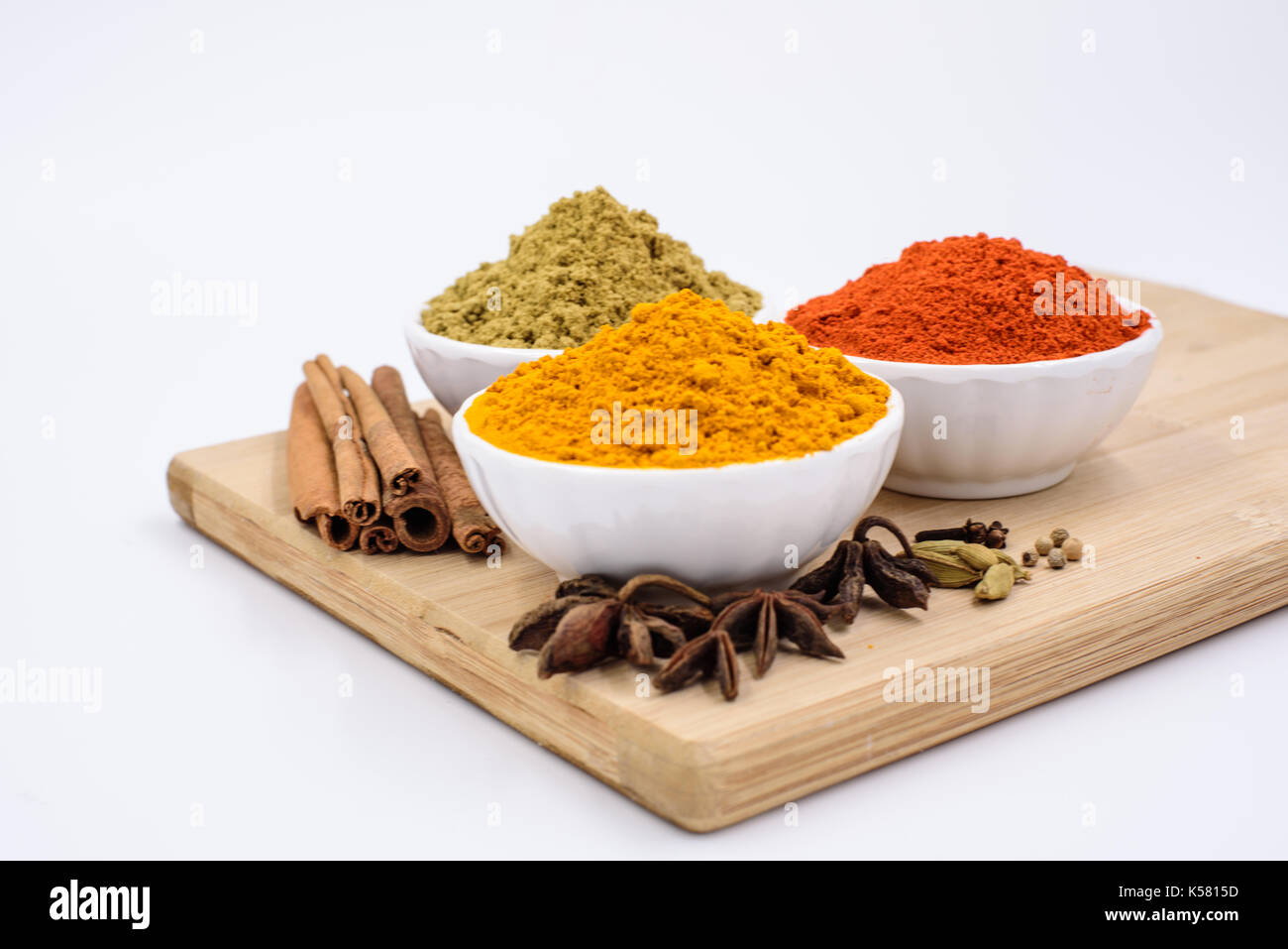 Herbs and spices on a chopping board Stock Photo - Alamy