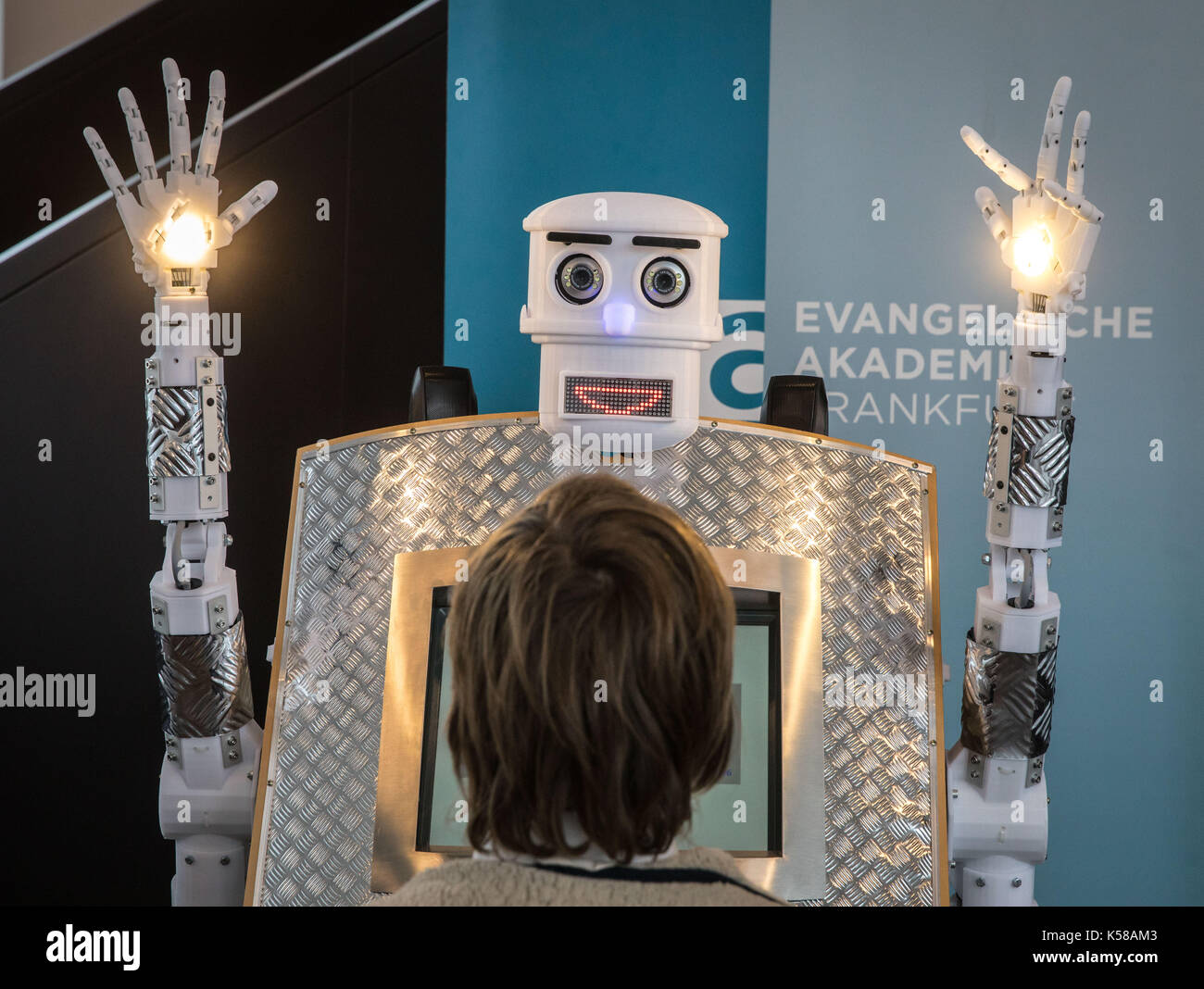 The robot BlessU-2 blesses 13-year-old Moritz in the Evangelical ...
