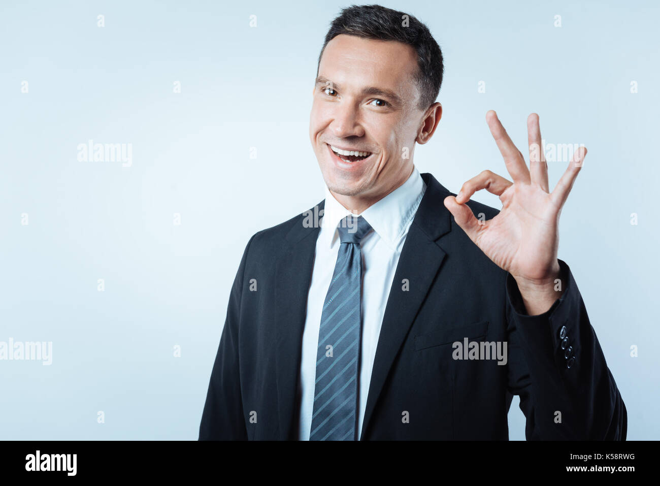 Nice positive man being happy about his success Stock Photo - Alamy
