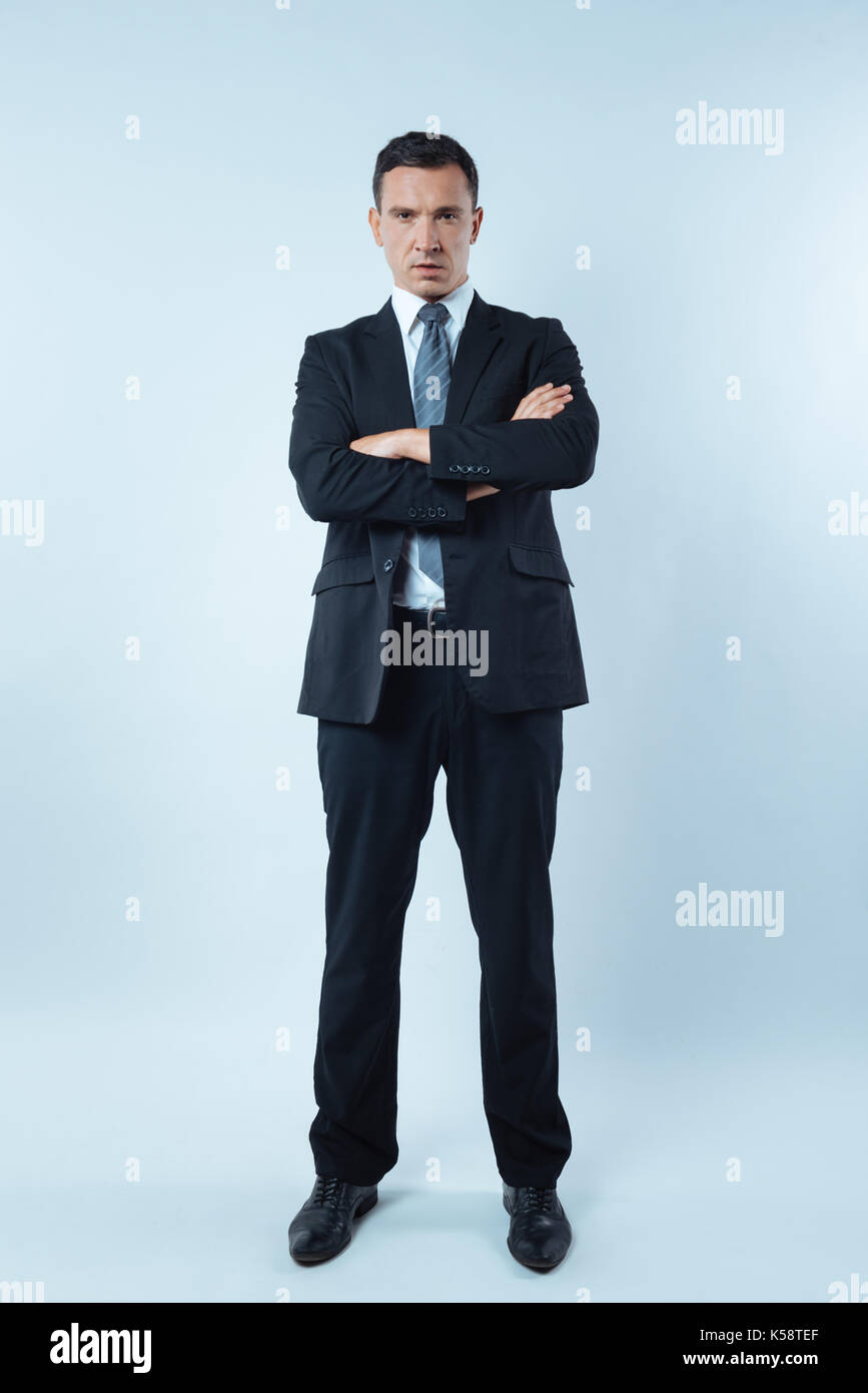 Successful smart businessman showing his confidence Stock Photo - Alamy
