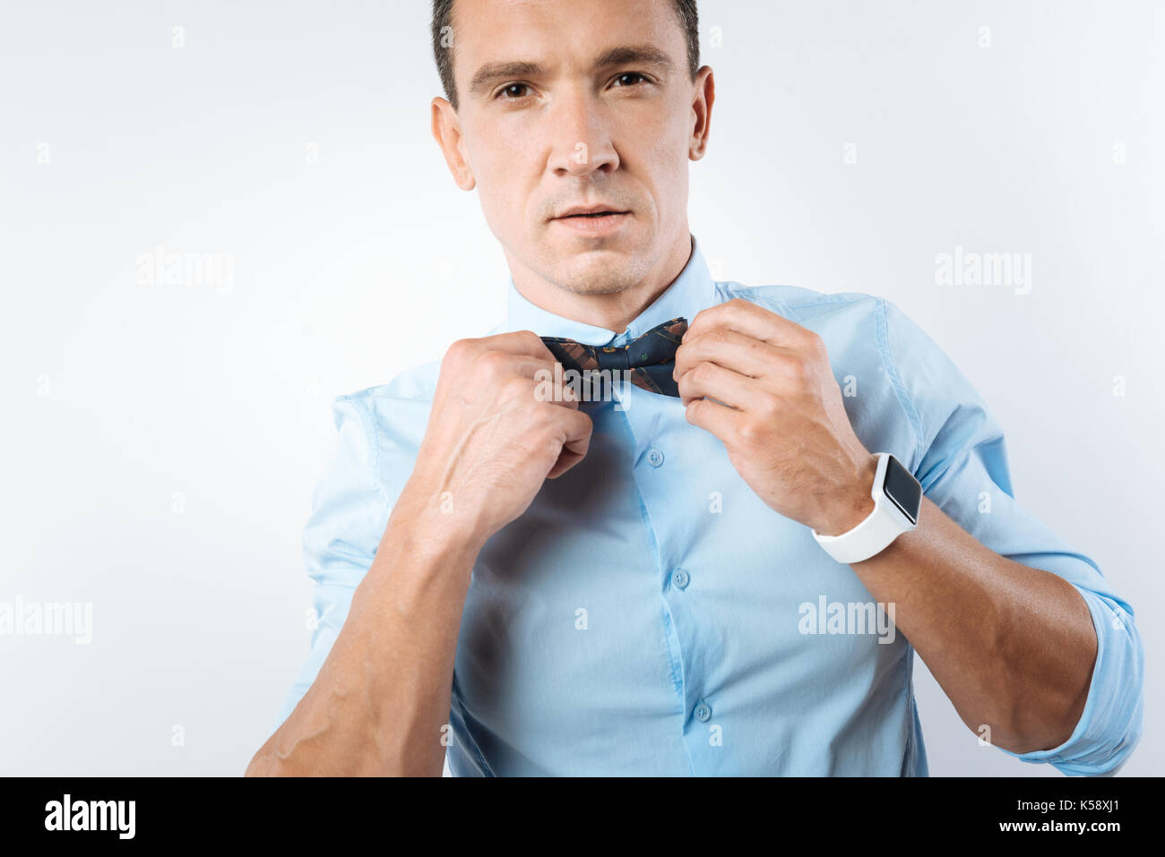 Fixing bow tie hi-res stock photography and images - Alamy