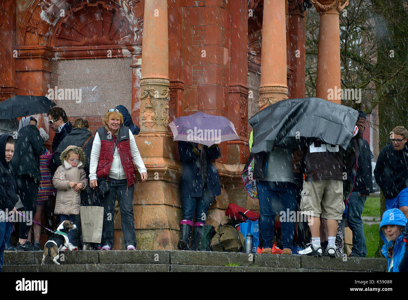 People take shelter from a sudden hail storm in mid April at Preston ...