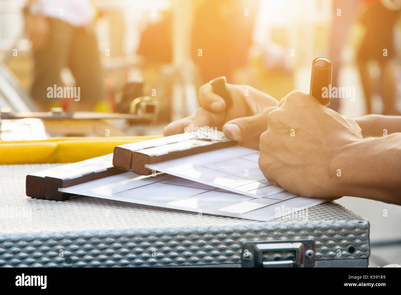 behind the scene, Labeling the Slate on set Stock Photo - Alamy