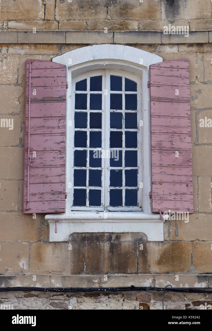 Old window exterior with open shades on decayed facade Stock Photo - Alamy