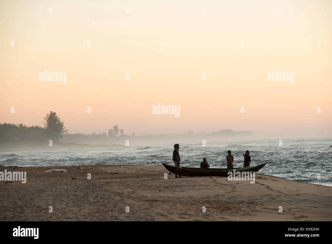 Fishing boat on the beach at sunrise, Manakara, Madagascar Stock Photo ...
