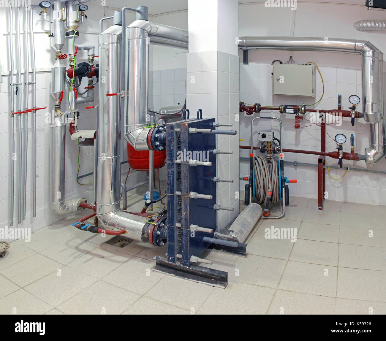 Utility room in house basement with boilers and pipes Stock Photo - Alamy