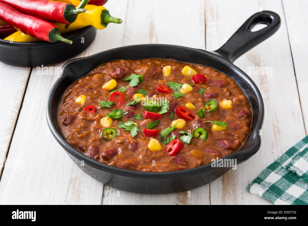Traditional mexican tex mex chili con carne in a frying pan on white ...
