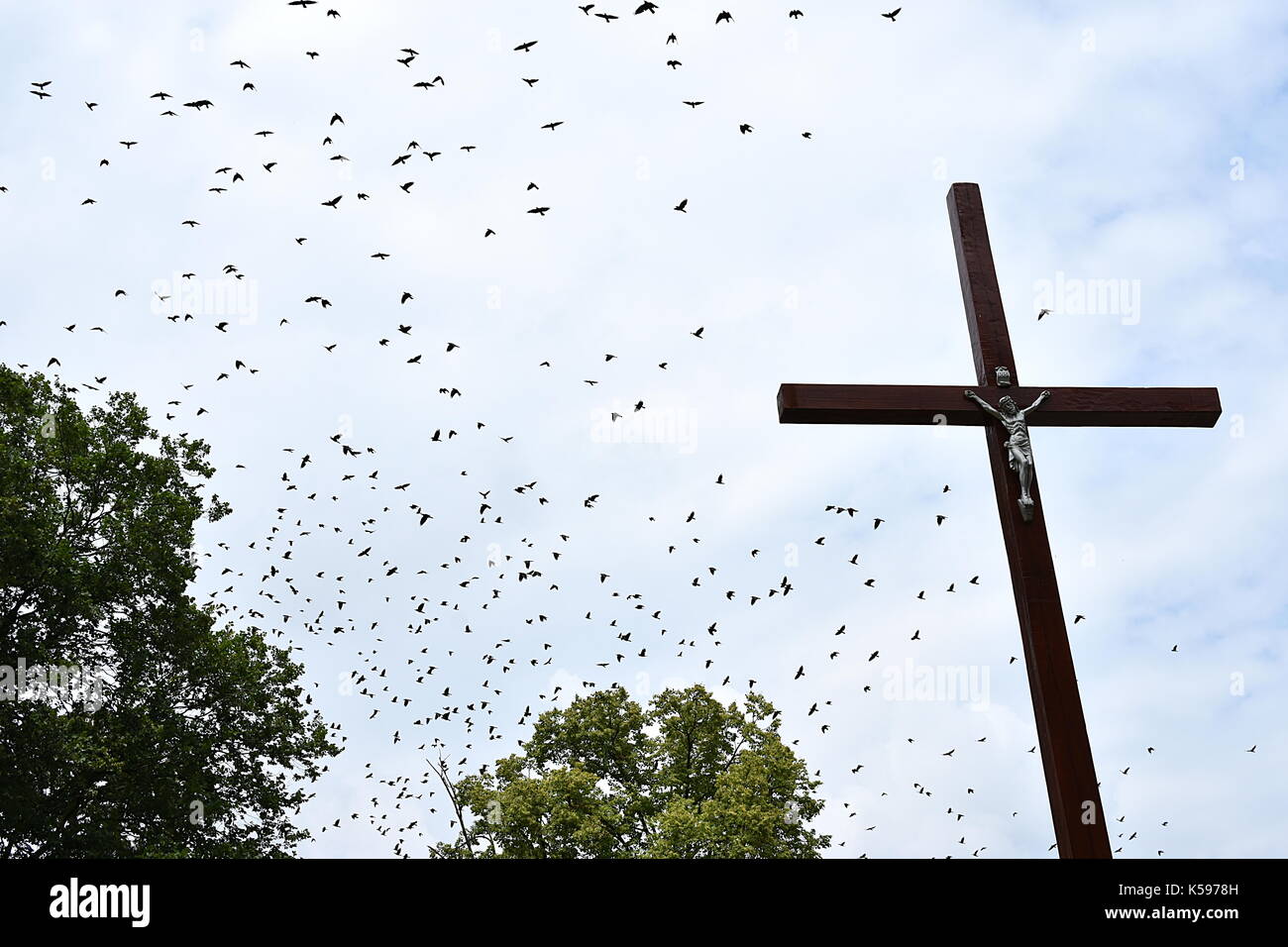 Cross with crows Stock Photo - Alamy