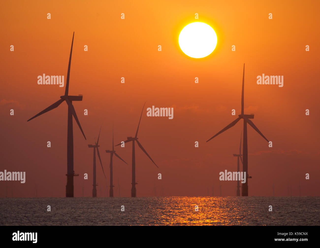 Sunrise over the Lincs Offshore Wind Farm off the coast of Lincolnshire ...