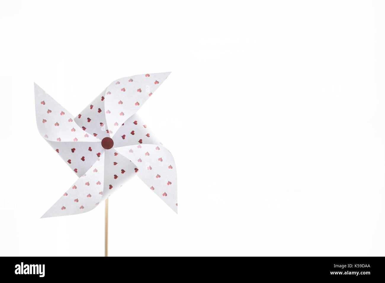 Hearts paper pinwheel isolated on white background Stock Photo - Alamy