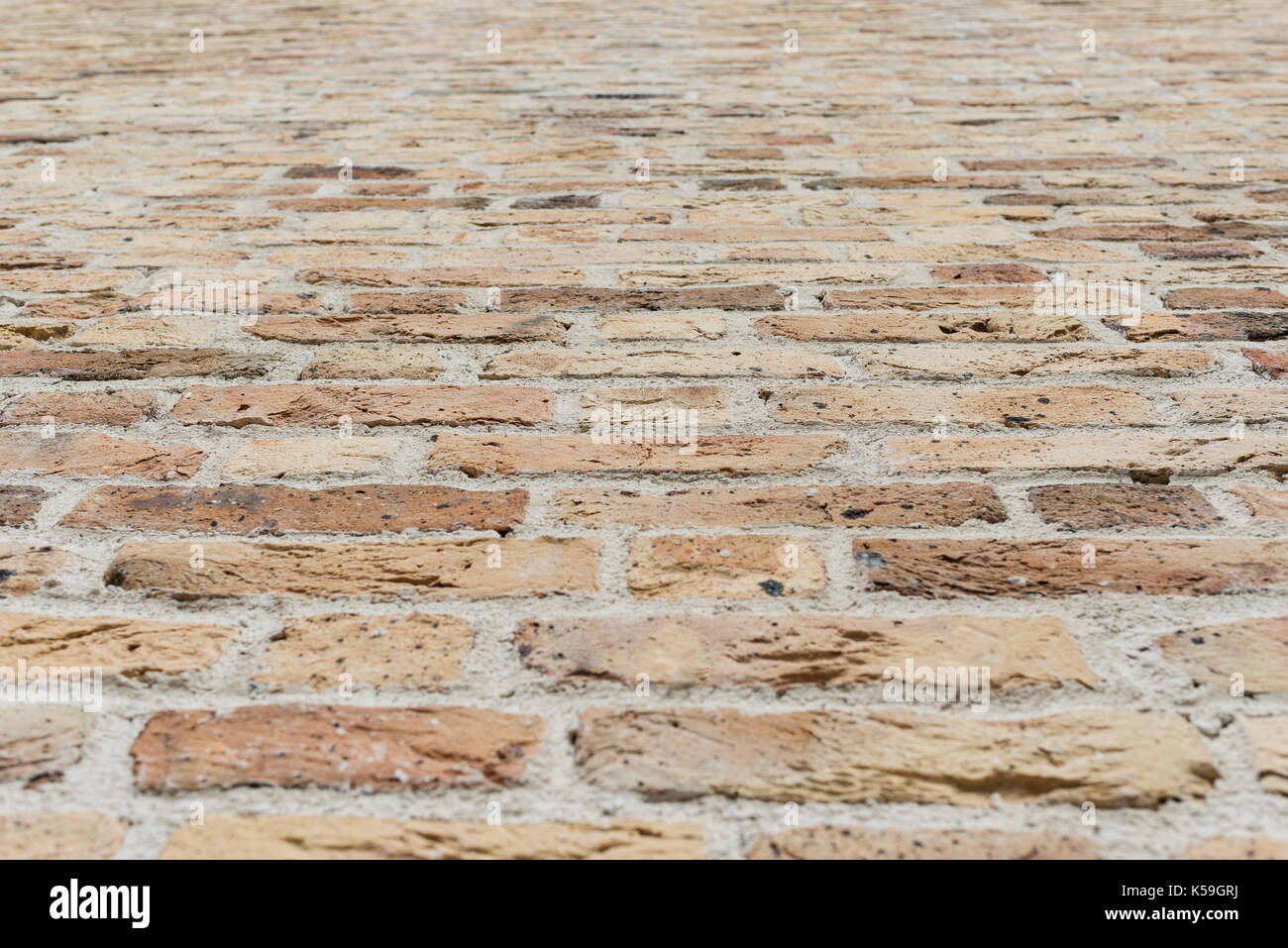 Old brick paving. Background Stock Photo - Alamy