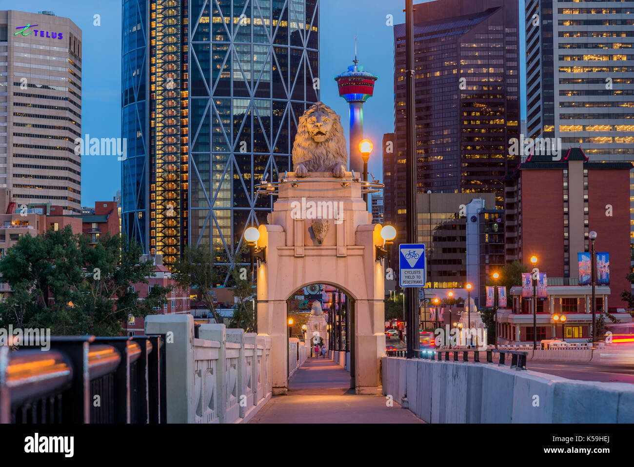 Stone lion on Centre Street Bridge, and Calgary skyline, Calgary ...