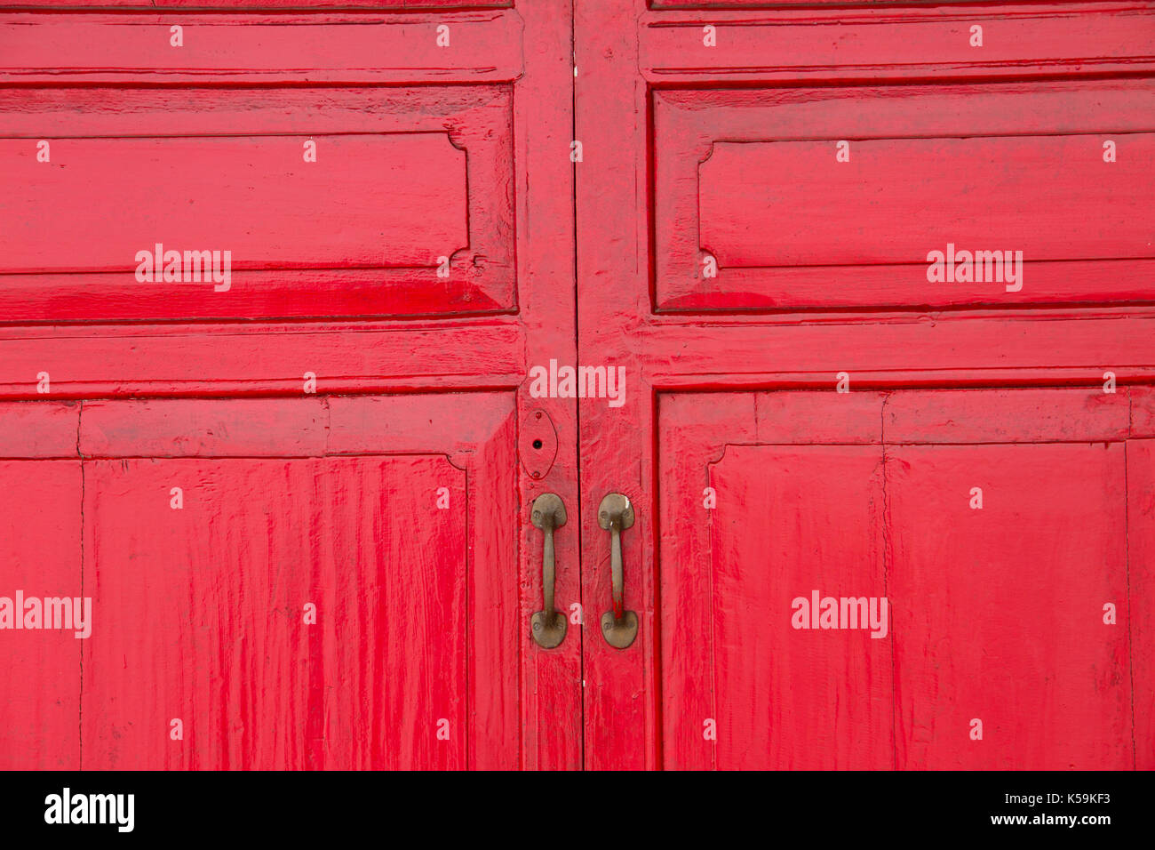 Red wooden closed door on white background Stock Photo - Alamy