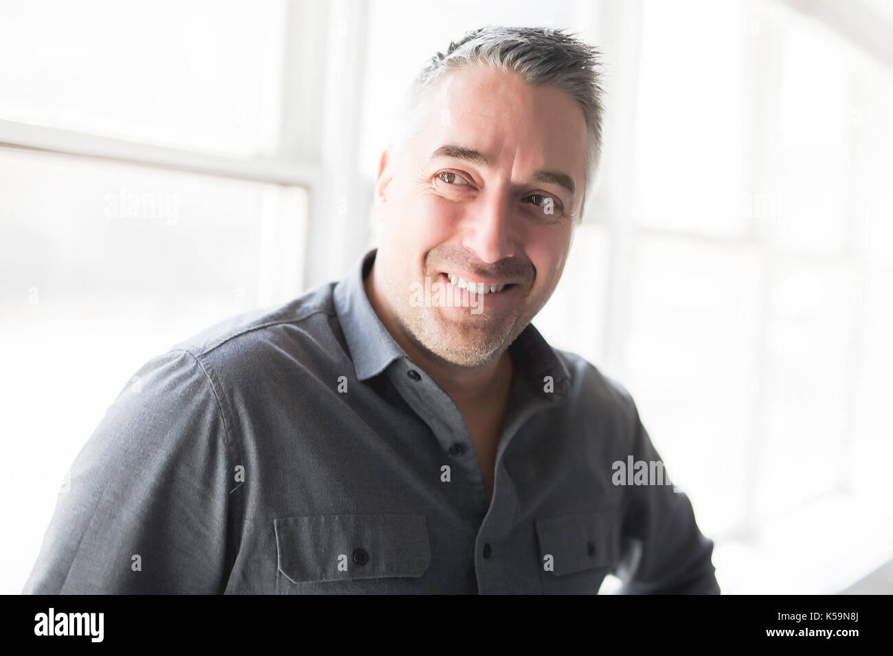Portrait of handsome and happy guy Stock Photo - Alamy