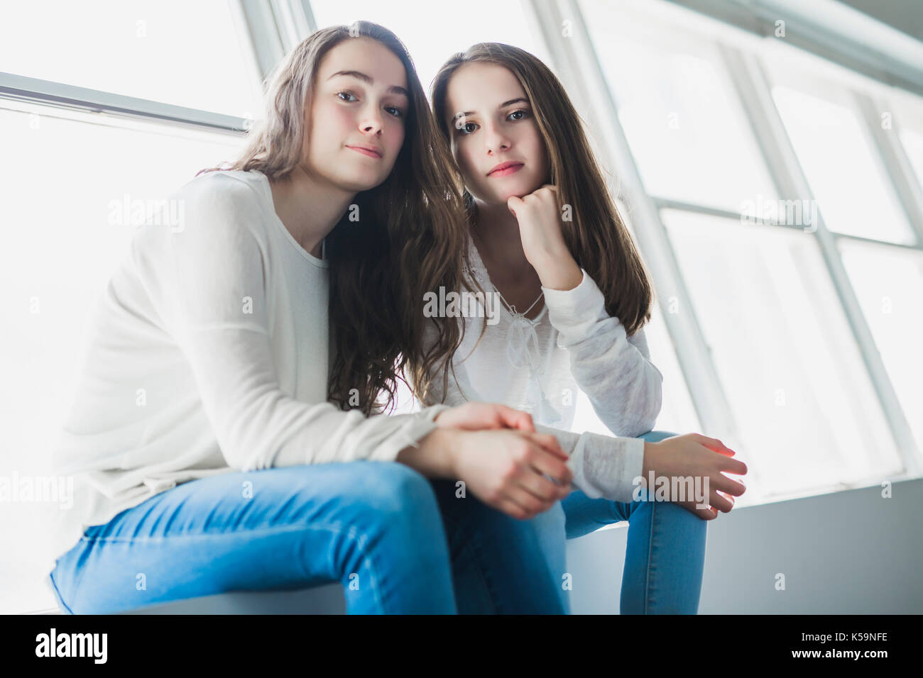 closeup portrait of hugging 2 beautiful young women having fun Stock ...