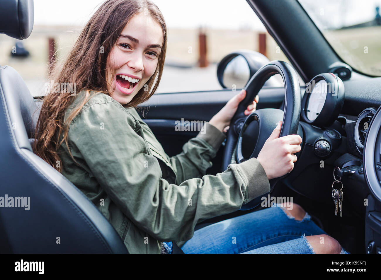 Woman car alone happy drive hi-res stock photography and images - Alamy