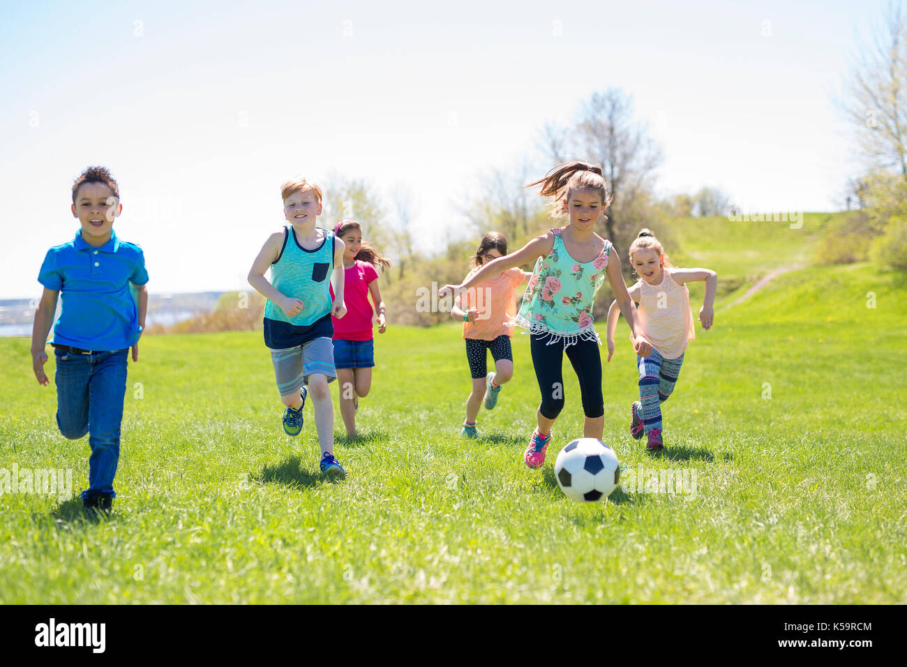 Boys and girls playing soccer hi-res stock photography and images - Alamy