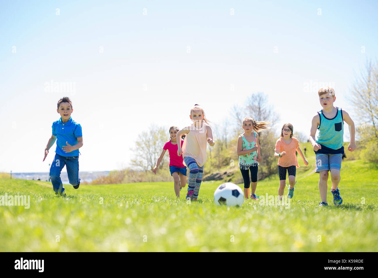Kids play football outside ground hi-res stock photography and images ...