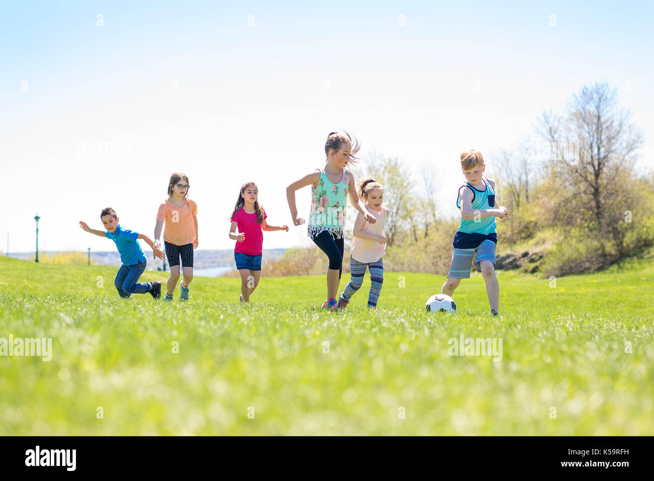 Boys and girls playing soccer hi-res stock photography and images - Alamy