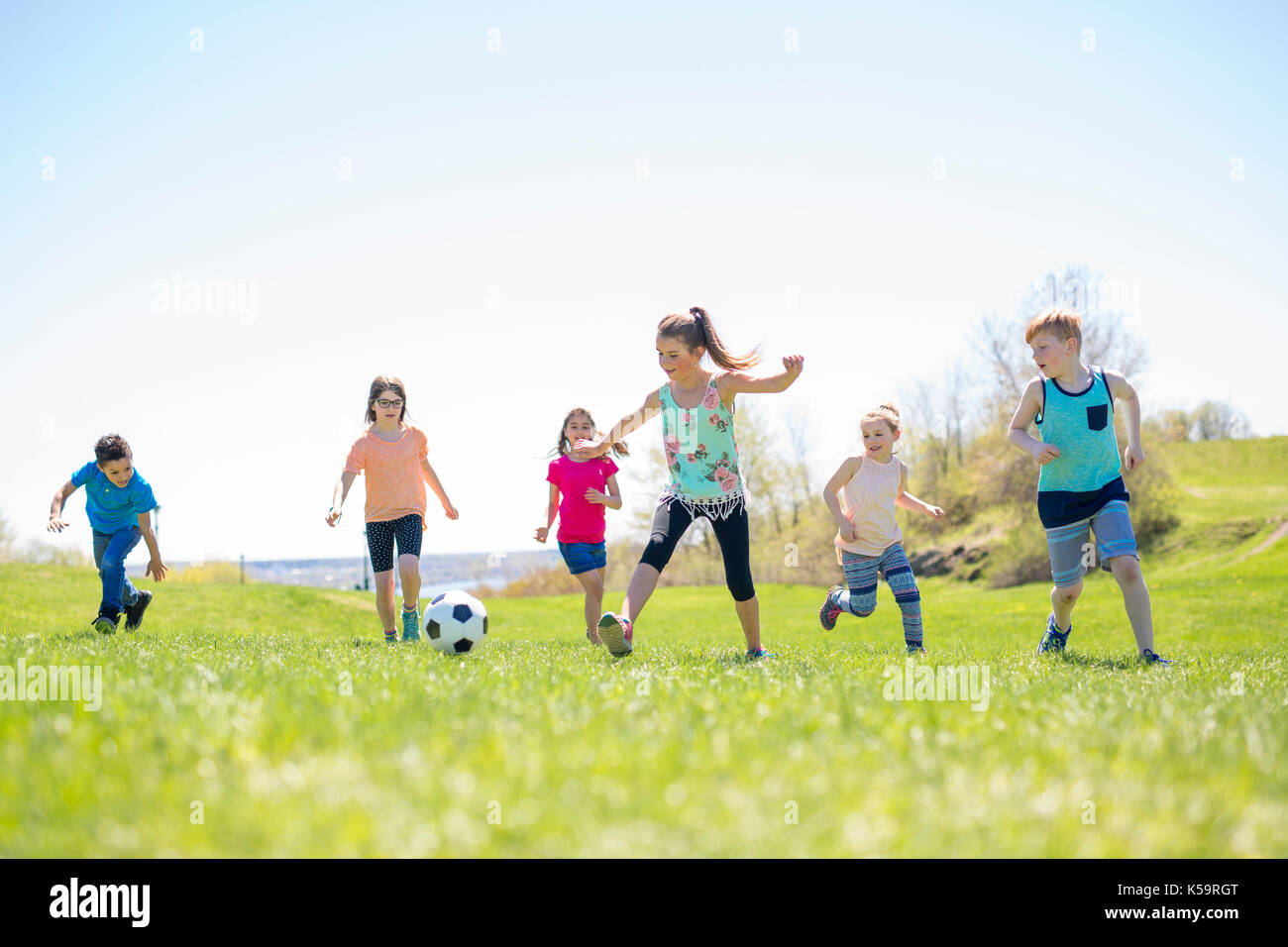 Boys and girls playing soccer hi-res stock photography and images - Alamy