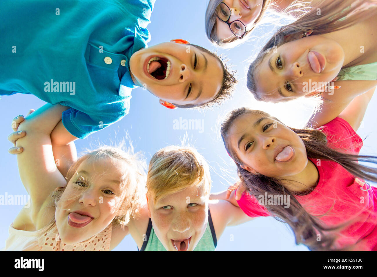 Group of child have fun on a field Stock Photo - Alamy