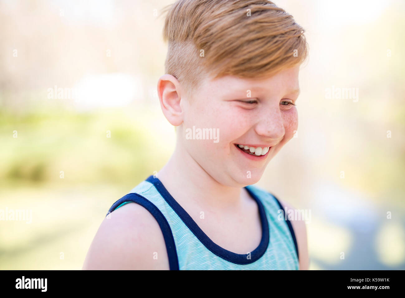 Portrait of a little girl on a yellow background. with his brother ...