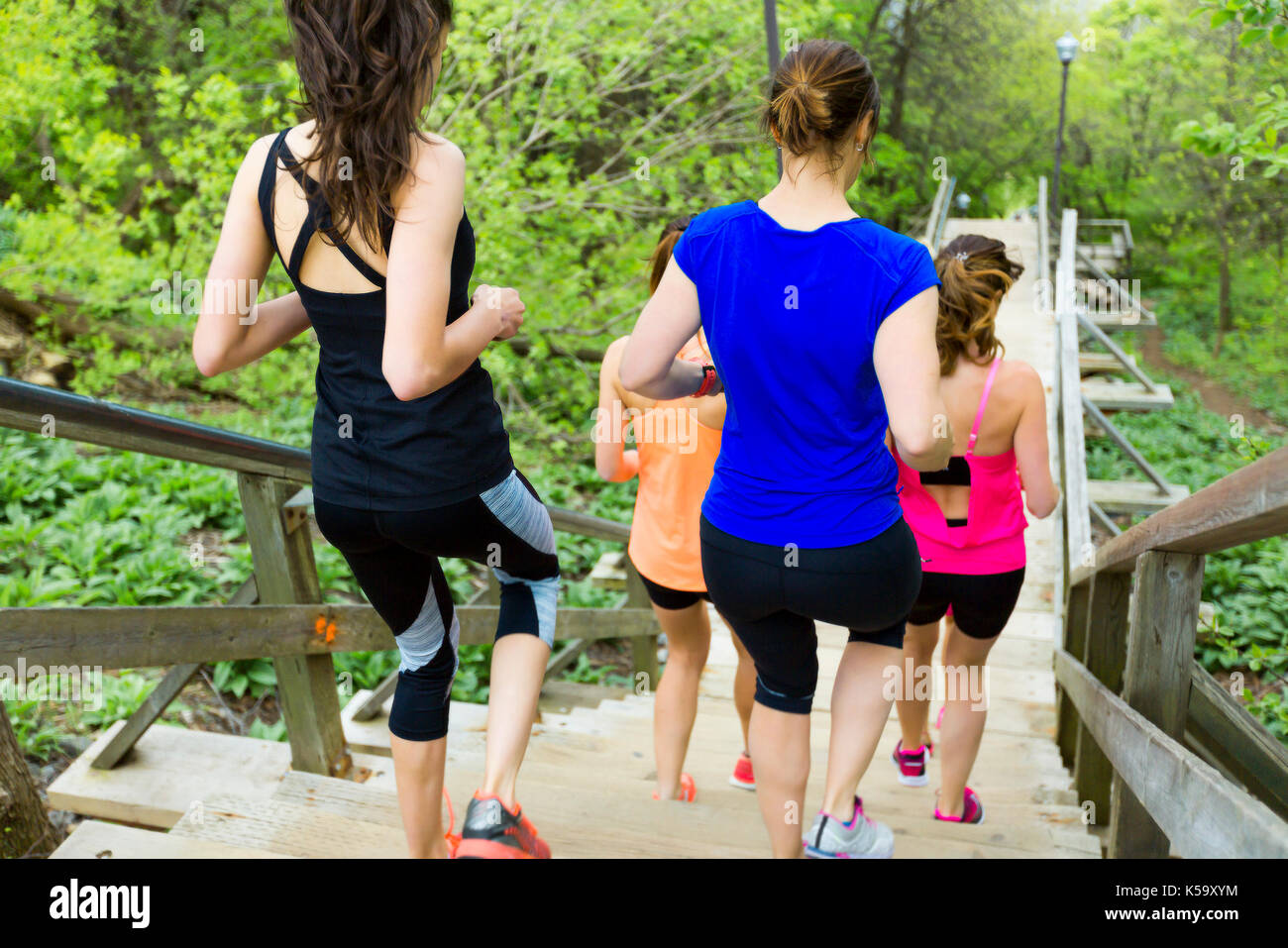 group of people enjoying in the fitness having fun running outside ...