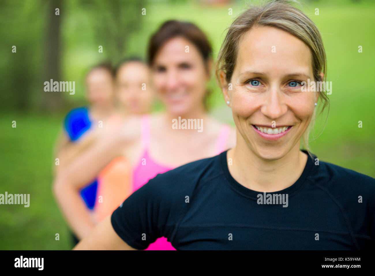 group of people enjoying in the fitness having fun running outside ...