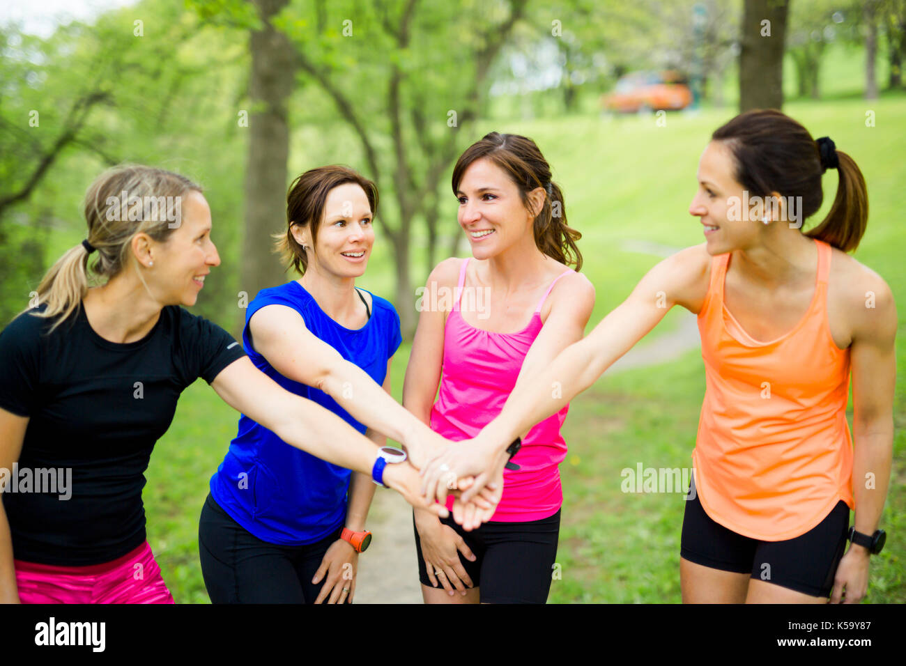 group of people enjoying in the fitness having fun running outside ...