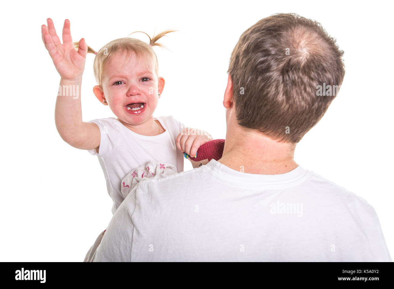 Sad unhappy crying cute little young toddler girl wiping tears, isolated Stock Photo - Alamy