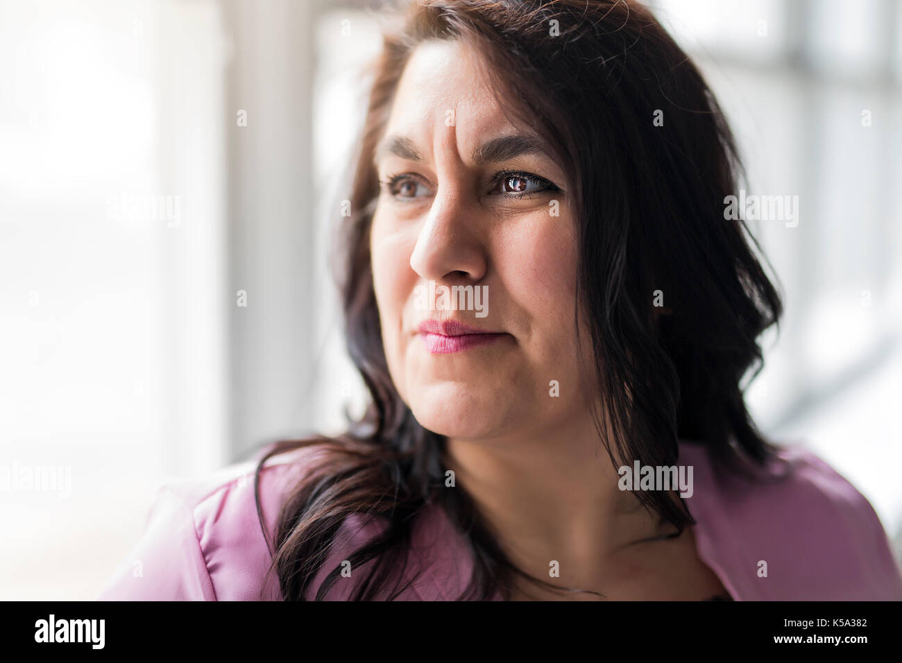 Shot of a beautiful mid adult woman smiling Stock Photo - Alamy