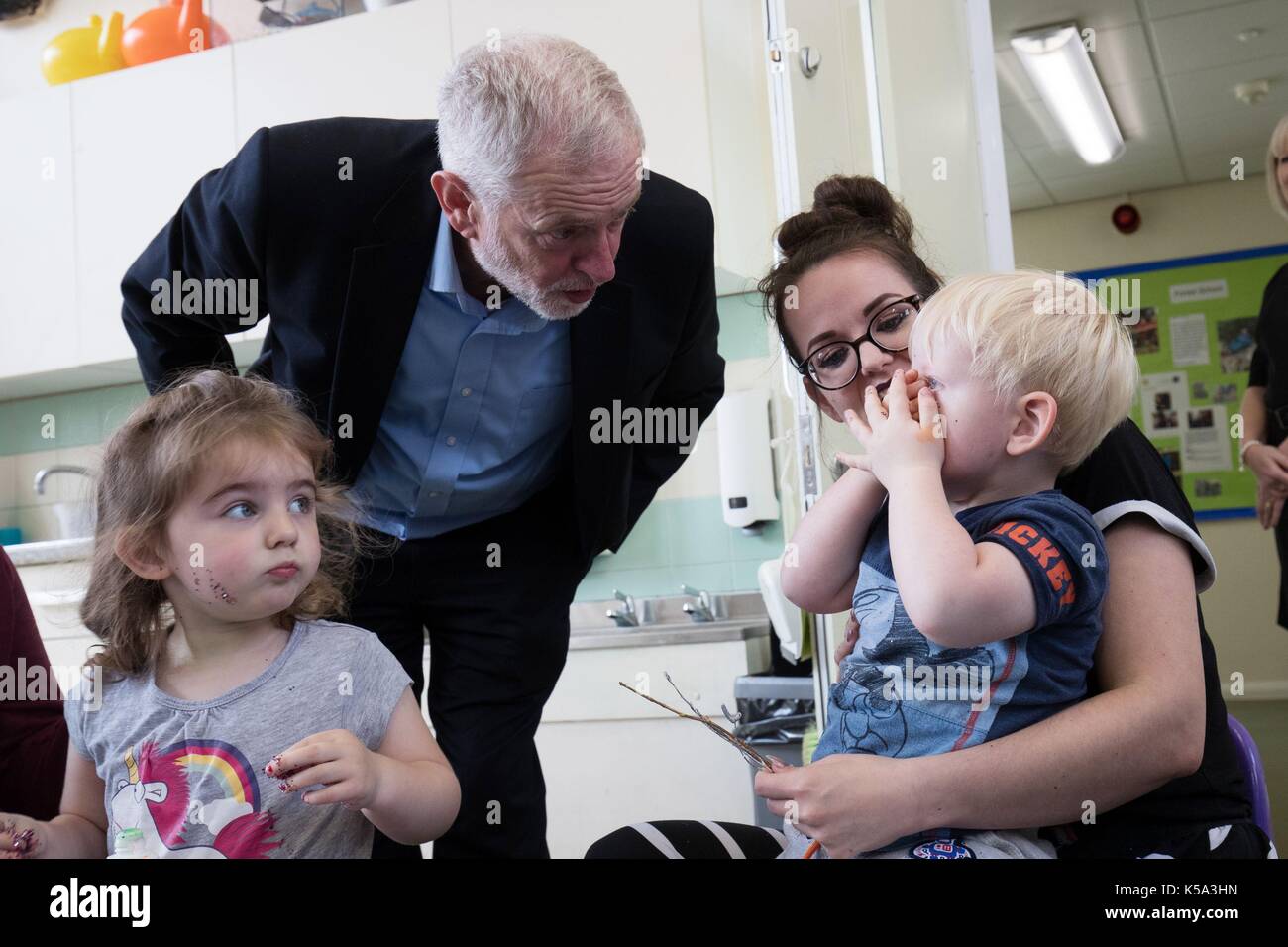 Labour leader Jeremy Corbyn speaks to children during a visit to the ...