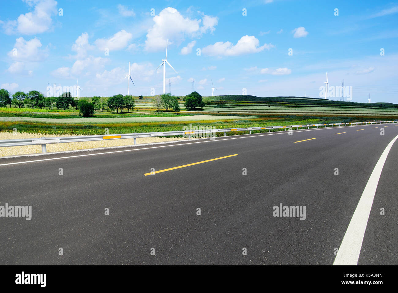Power generation wind power generator on the asphalt road Stock Photo ...
