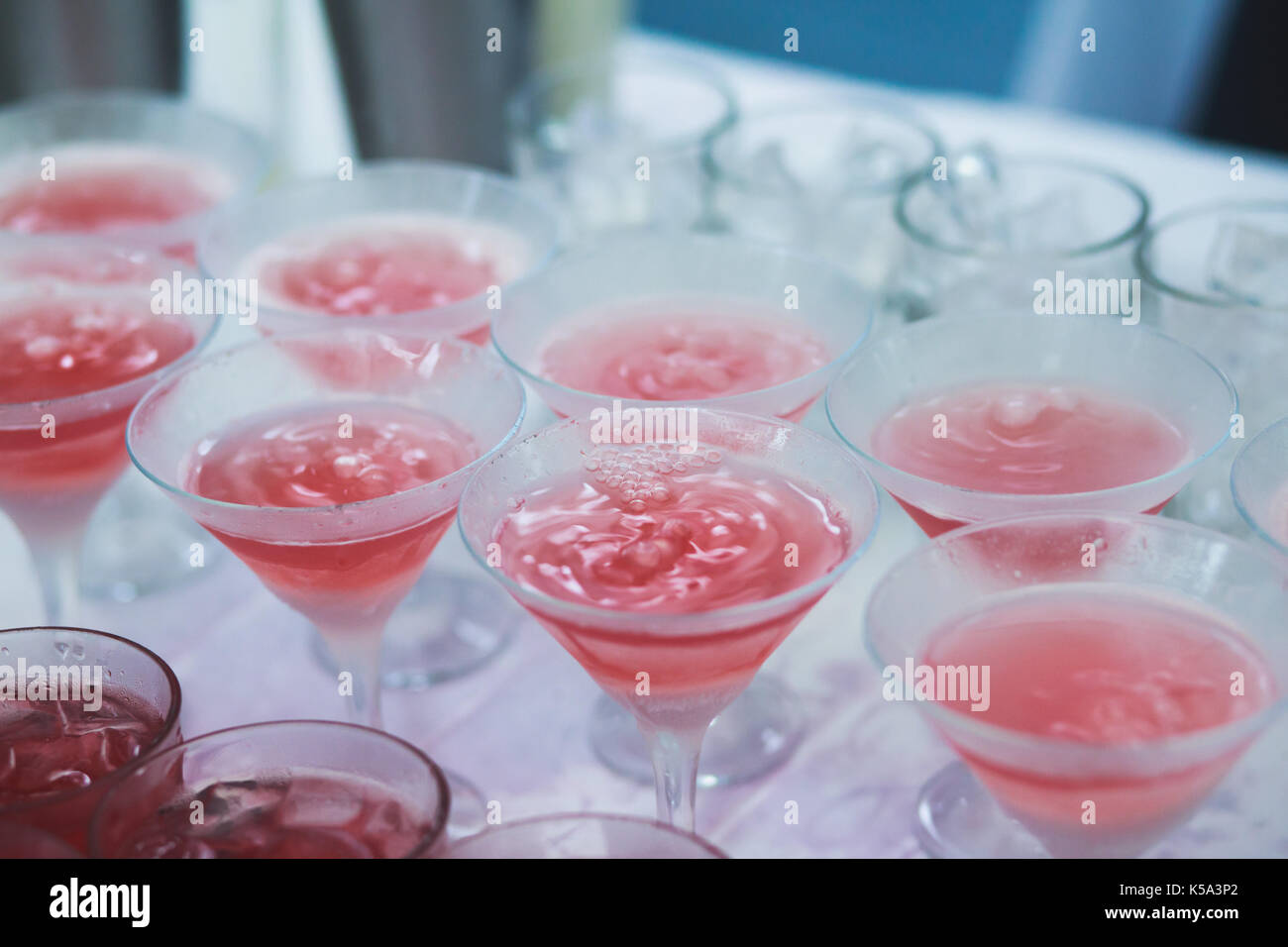 Beautiful line of different coloured alcohol cocktails on a open air ...