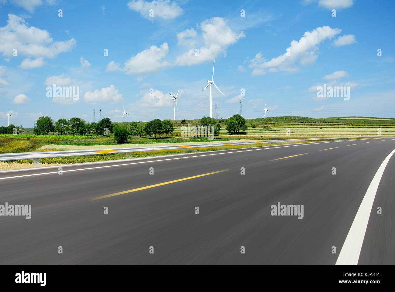 Power generation wind power generator on the asphalt road Stock Photo ...