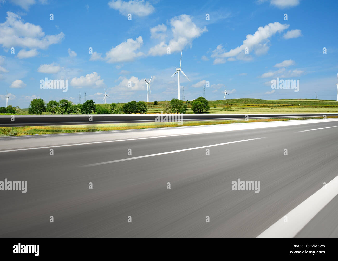 Power generation wind power generator on the asphalt road Stock Photo ...