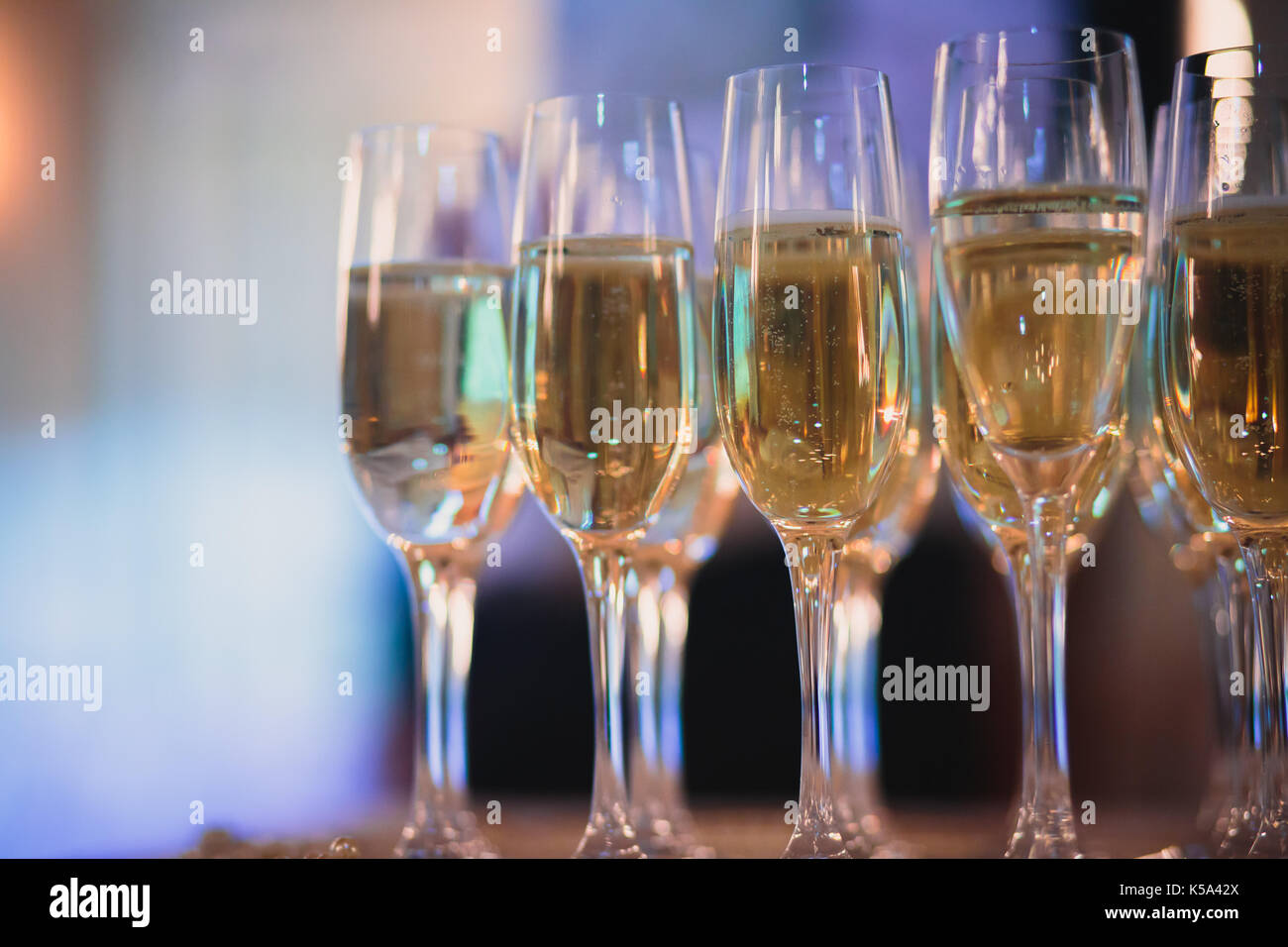 Beautiful line of different coloured cocktails on a open air party ...