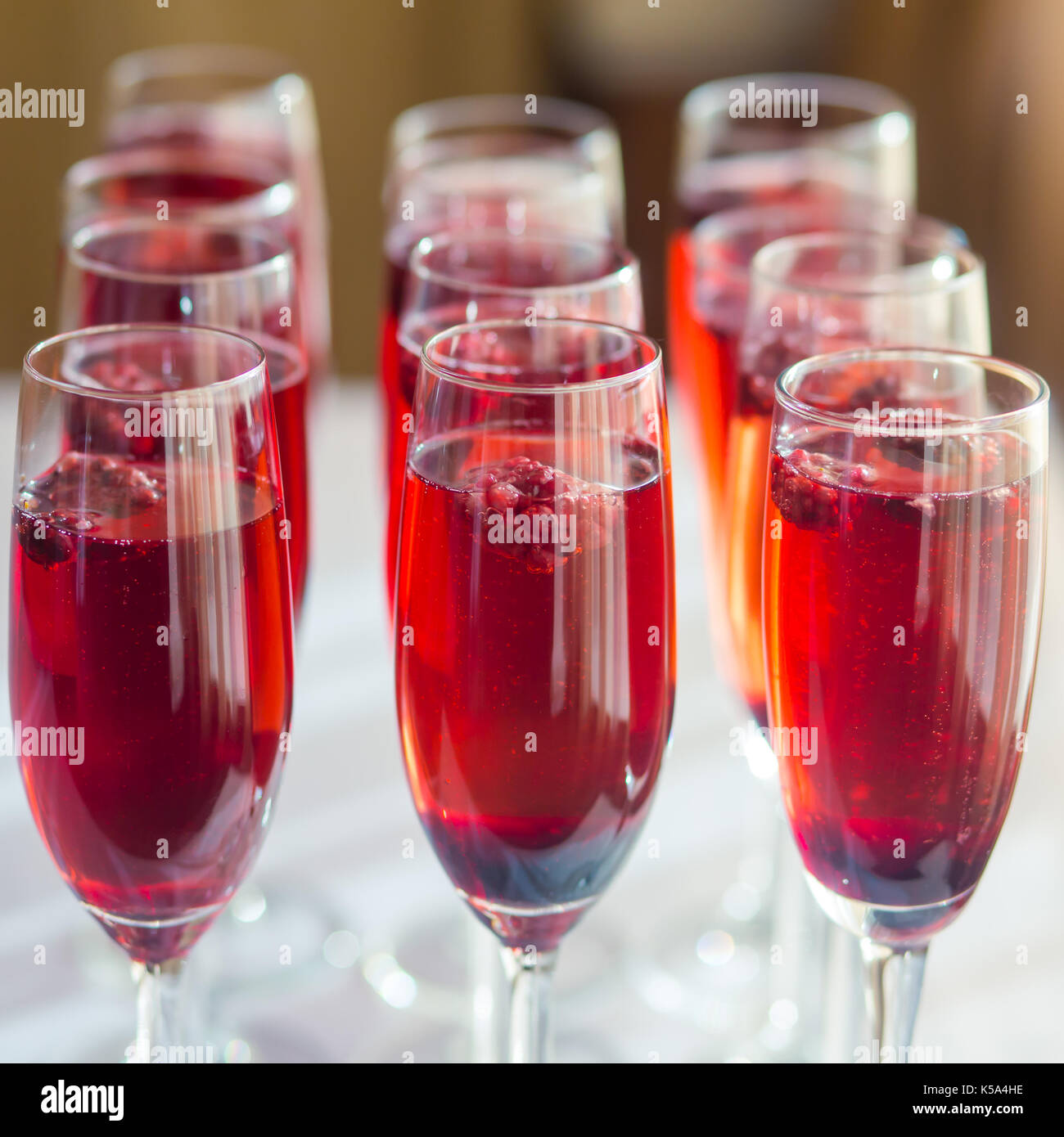 Beautiful line of different coloured cocktails on a open air party ...