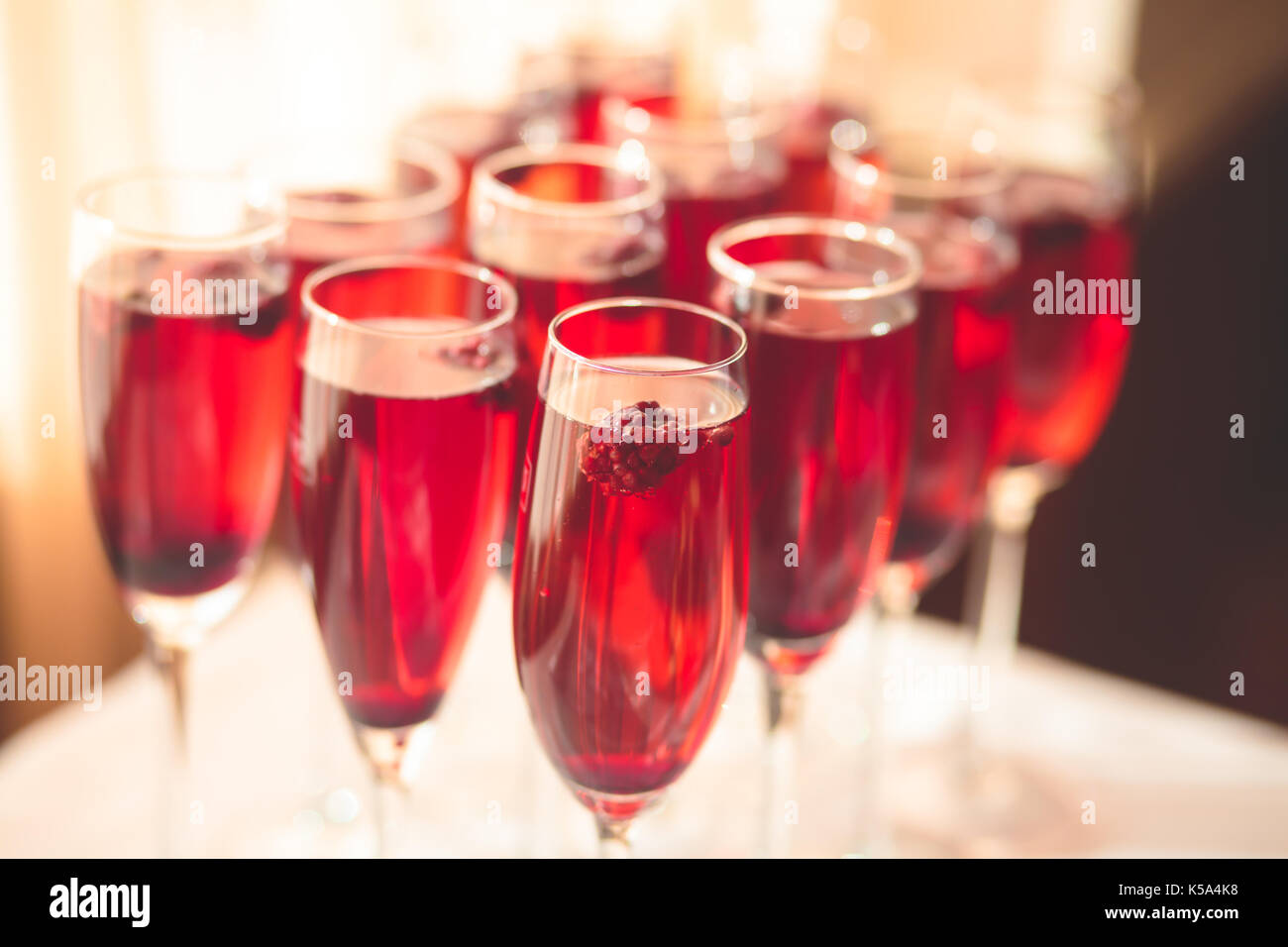 Beautiful line of different coloured cocktails on a open air party ...