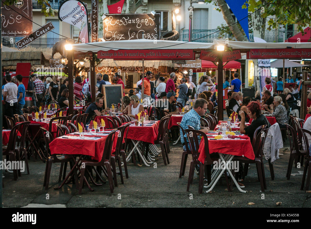 Tables at the street food market, Feria, Beziers, Herault, France Stock ...
