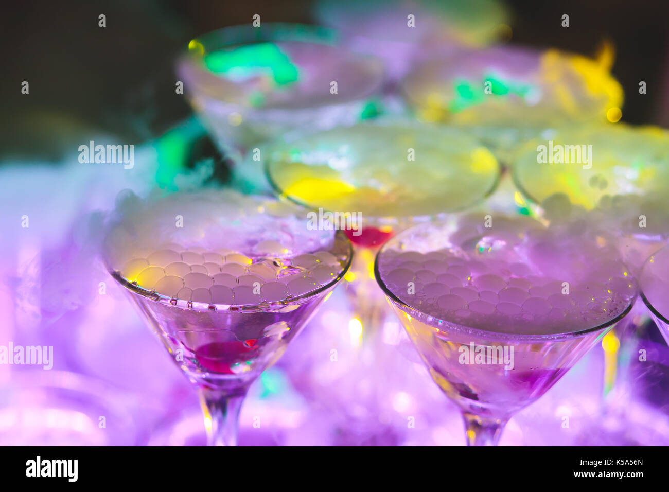 Beautiful line of different coloured cocktails on a open air party ...