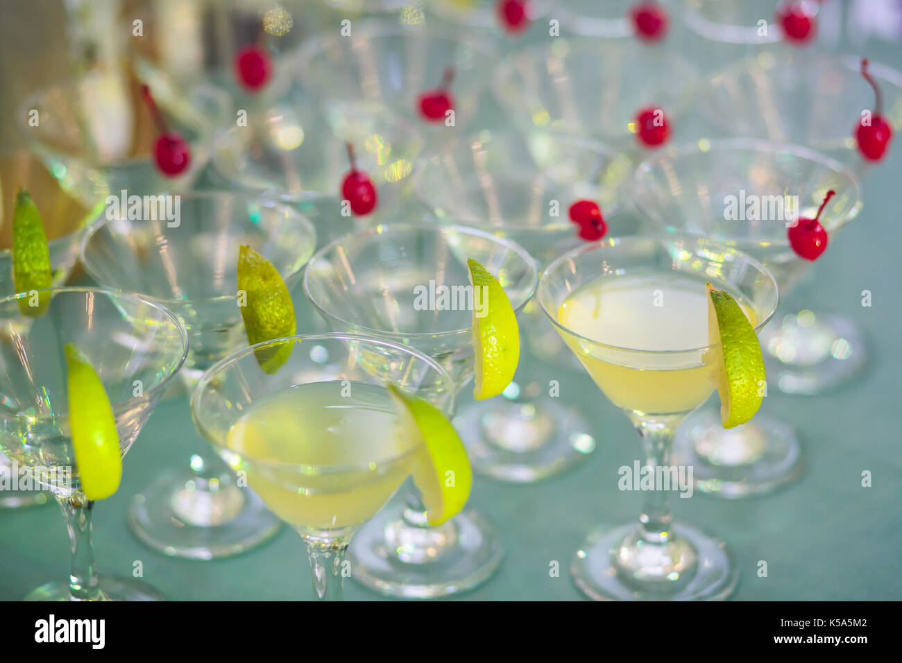 Beautiful line of different coloured cocktails on a open air party ...