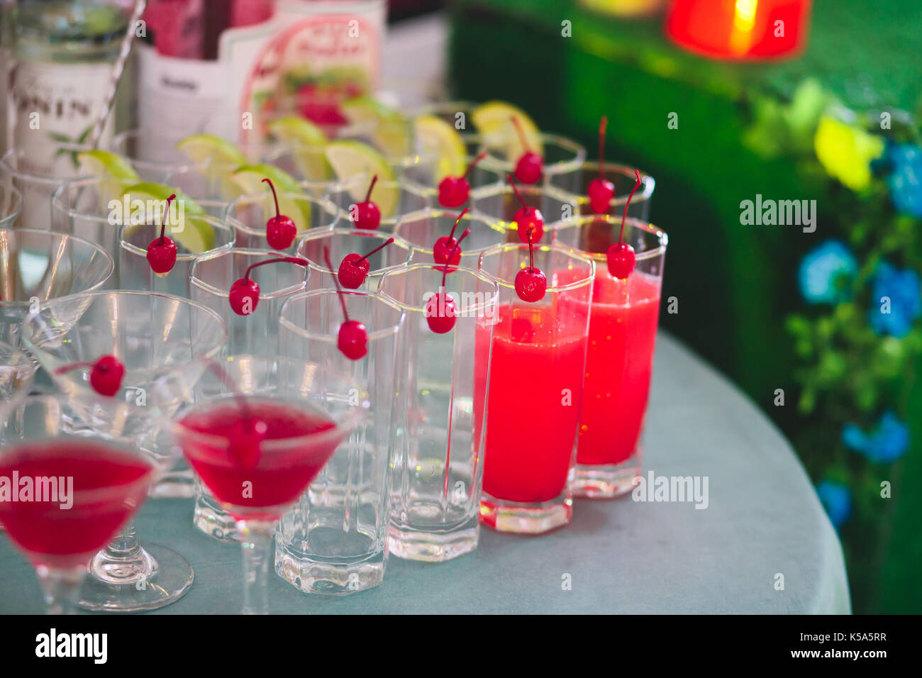 Beautiful line of different coloured cocktails on a open air party ...