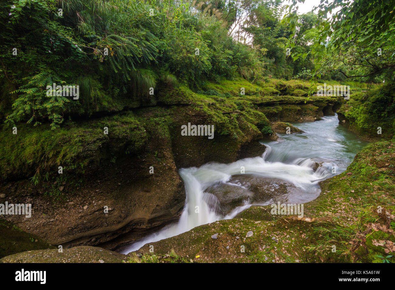 Water flows downstream to Devi's Falls in Pokhara, Nepal Stock Photo ...