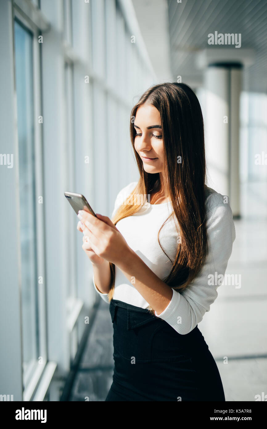 Business woman use phone in modern office. Office concept Stock Photo ...