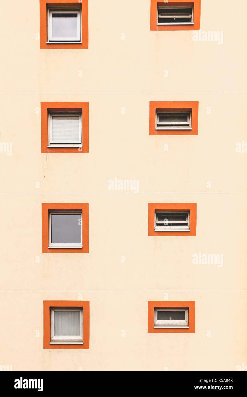 vertical alignment of square windows in an old residential building ...