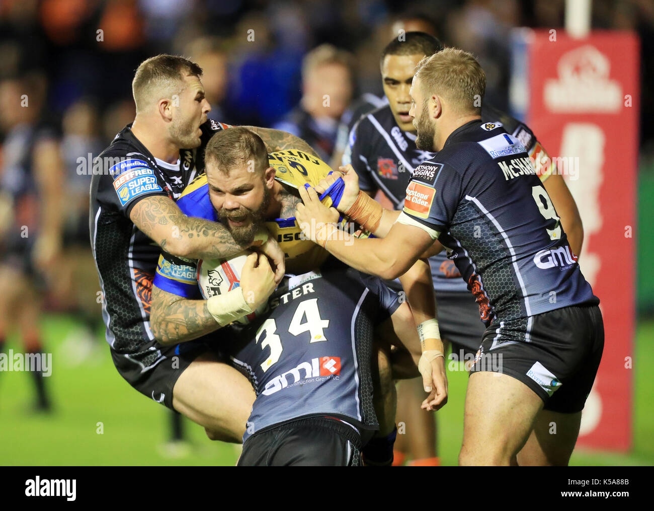 Leeds Rhinos' Adam Cuthbertson is tackled during the Super 8s match at ...