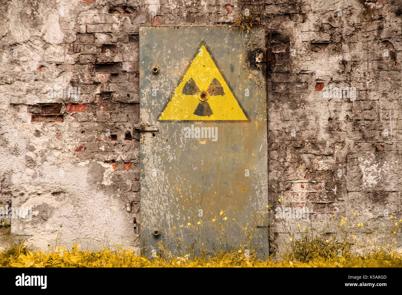 Radioactive (ionizing radiation) danger symbol painted on the old ...