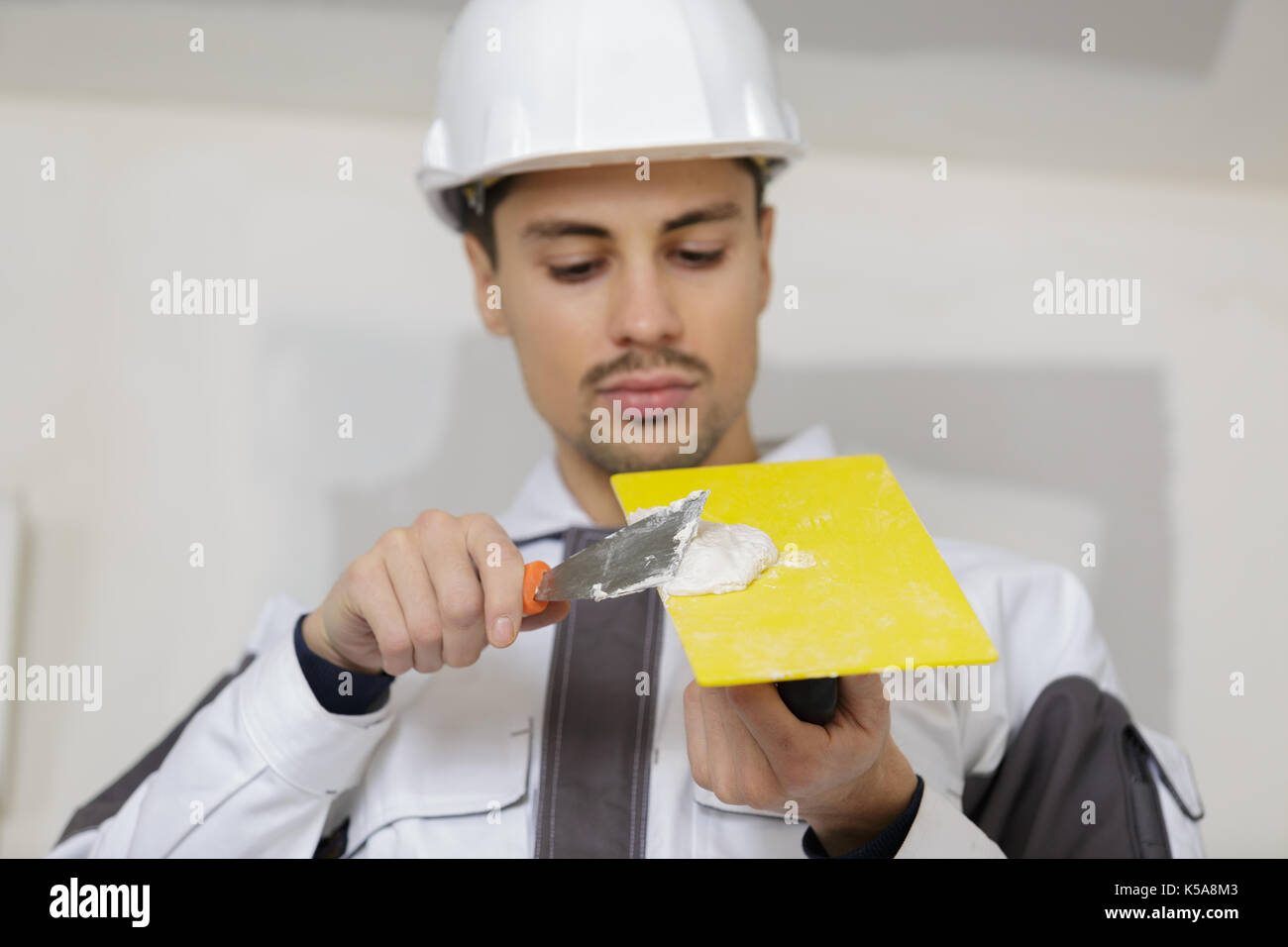 Wall filler hole hi-res stock photography and images - Alamy
