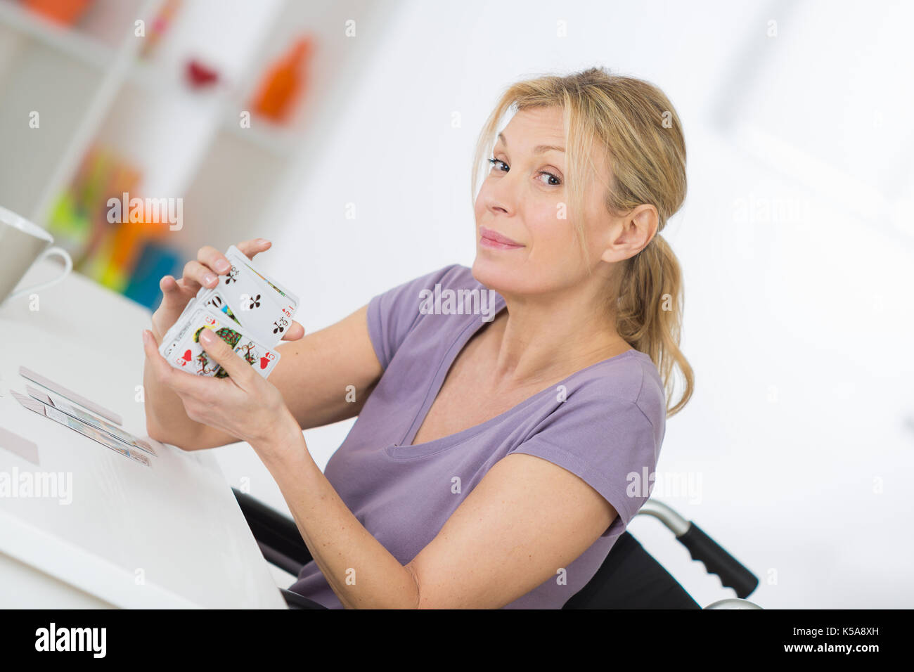 disabled lady playing cards Stock Photo - Alamy